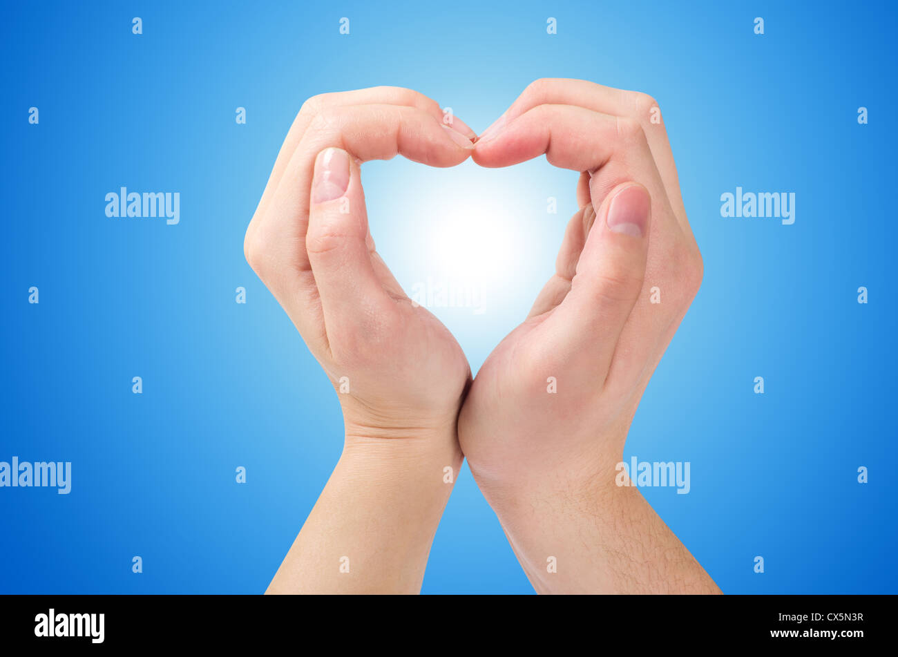 Two hands form a heart shape with their fingers Stock Photo - Alamy
