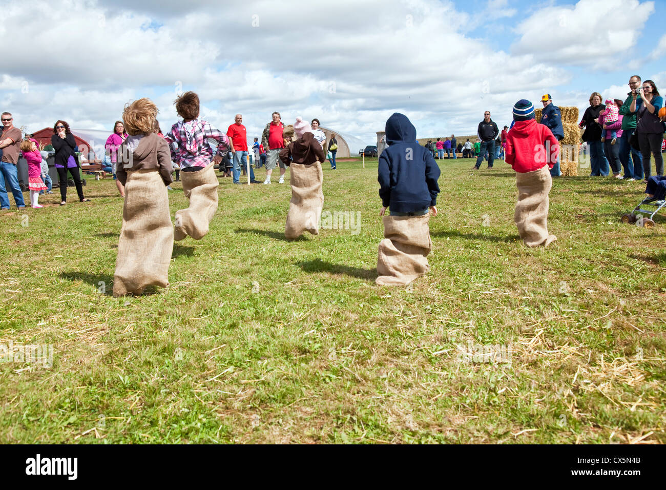 Kids in the potato sack race at the annual Scarecrow Festival held in ...