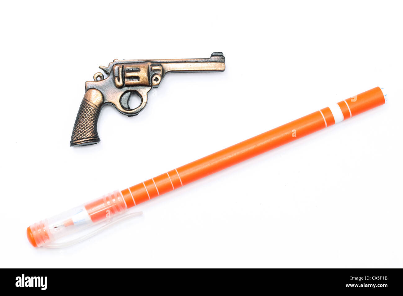 Toy gun and pen isolated on white background Stock Photo - Alamy