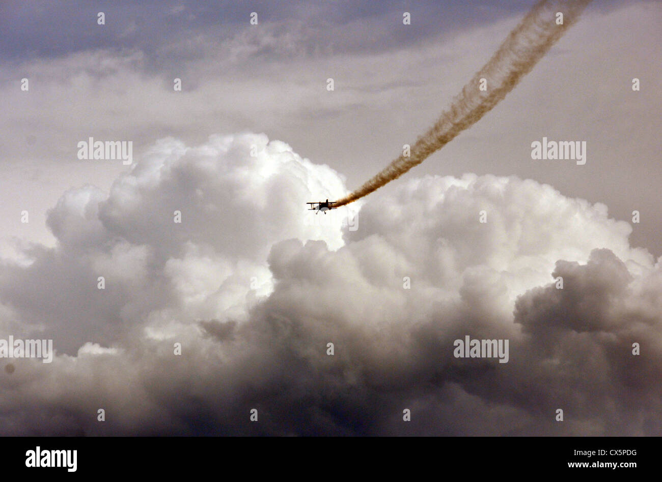 Airplane flying into clouds Stock Photo - Alamy