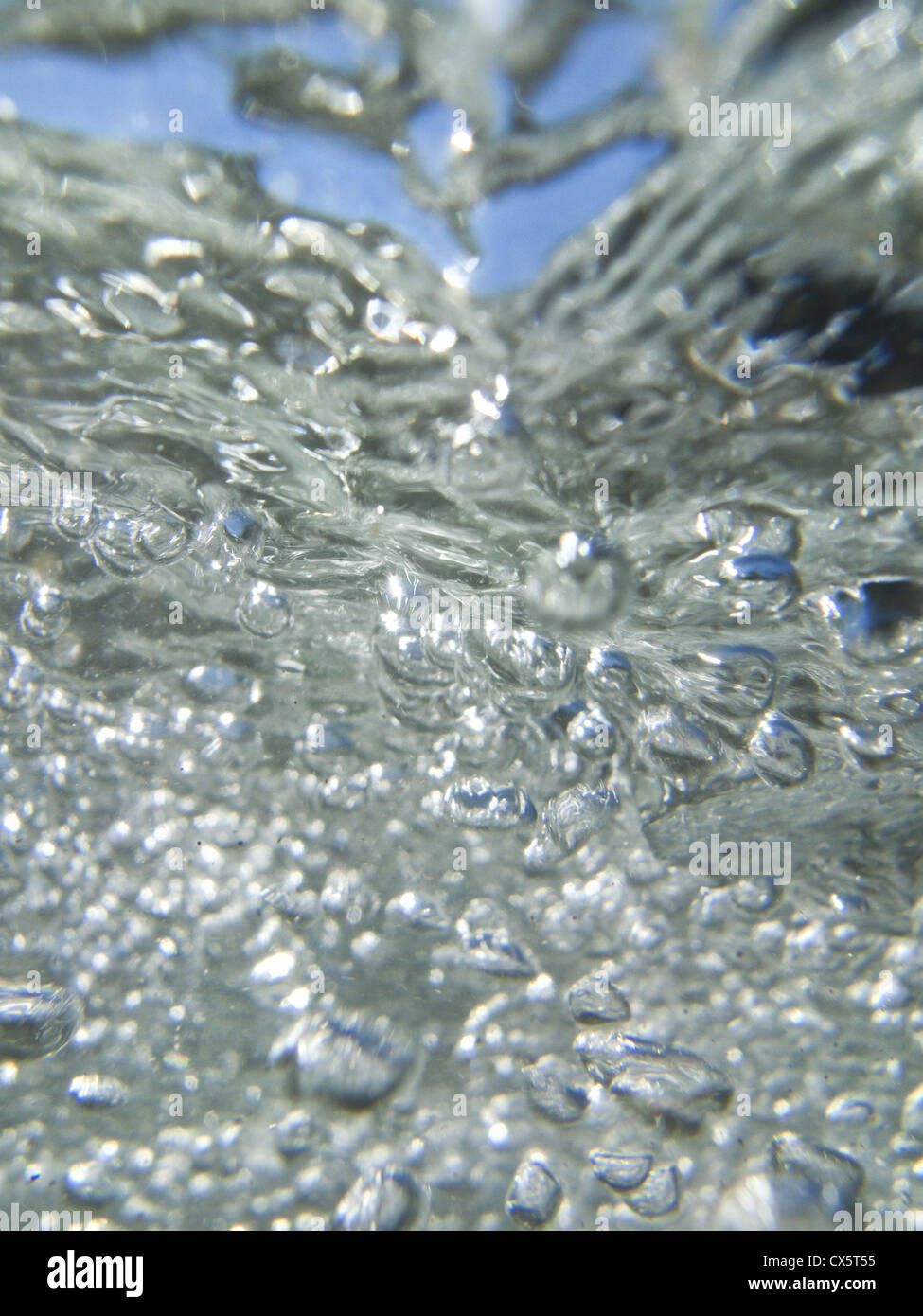 Bubbles made by a wave from below Stock Photo - Alamy