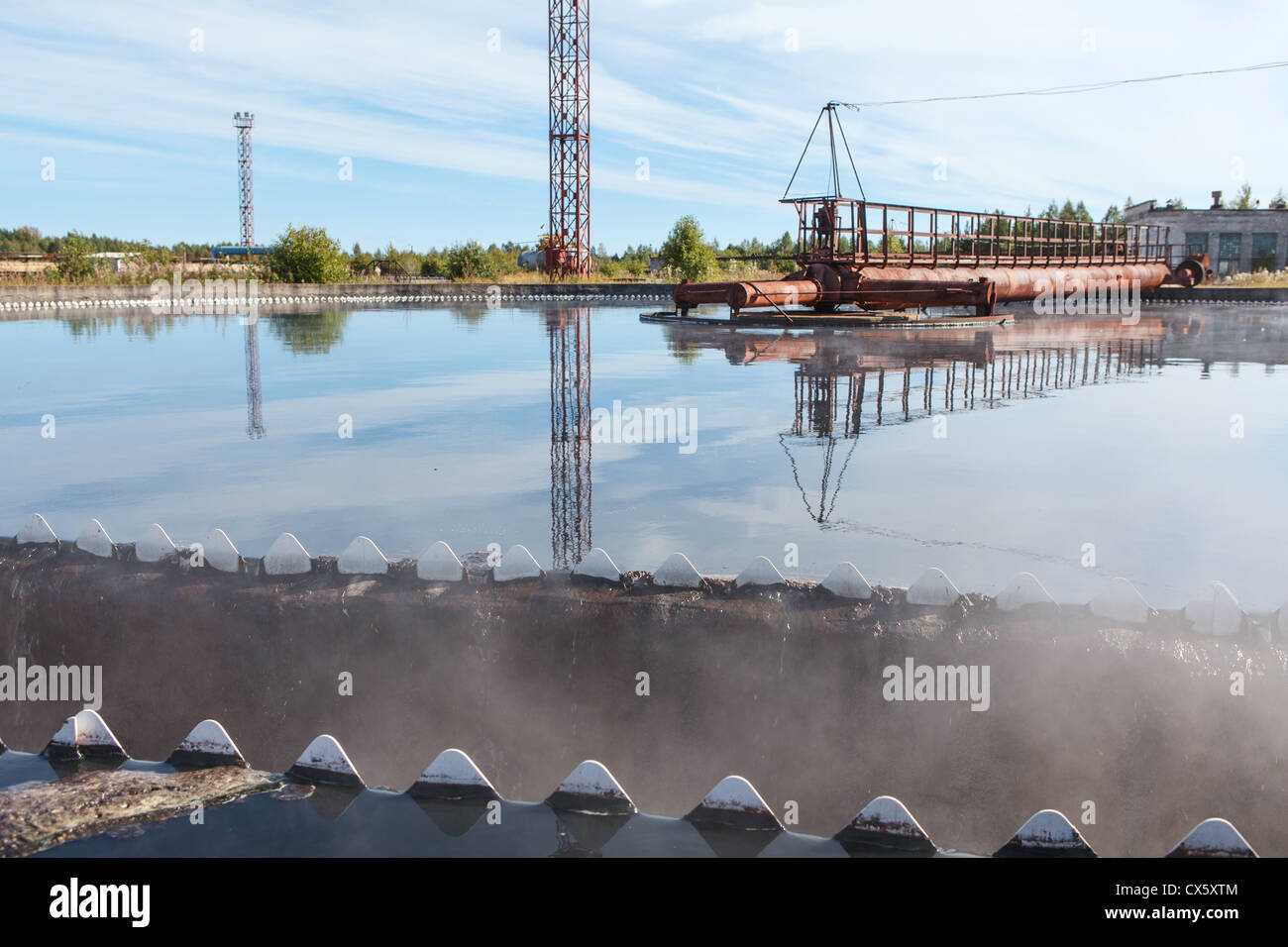 Water overflowing from the round edge of sedimentation tank. Sewage ...