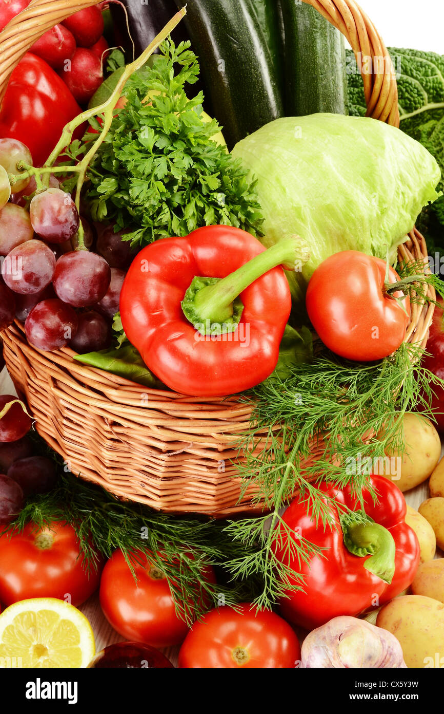 Composition with raw vegetables and wicker basket Stock Photo - Alamy