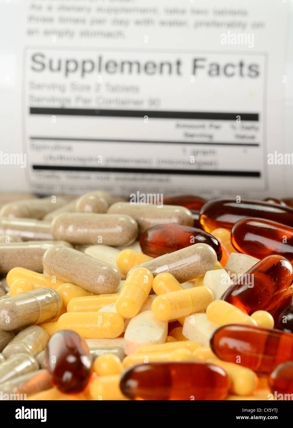 Composition with dietary supplement capsules and containers Stock Photo ...