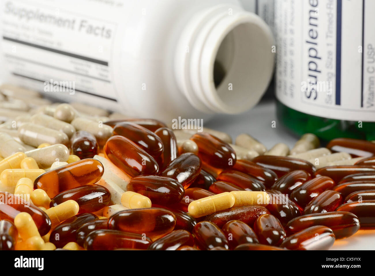 Composition with dietary supplement capsules and containers Stock Photo ...