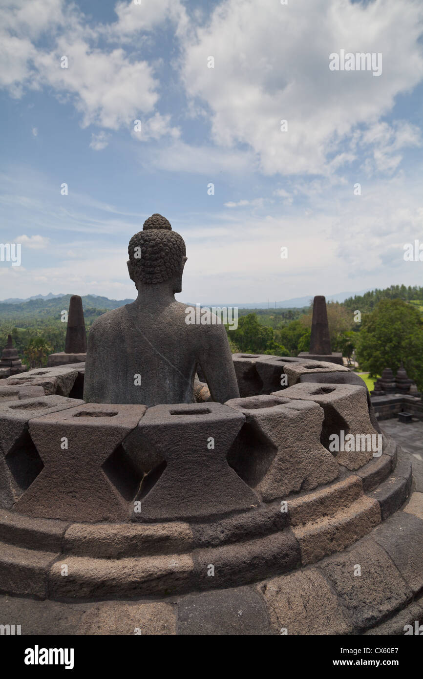 Buddha Statue on a Stupa of the Buddhist Temple Borobudur in Indonesia ...
