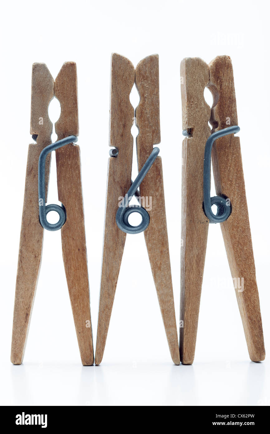 A bunch of clothes pins standing in front of a white background Stock ...