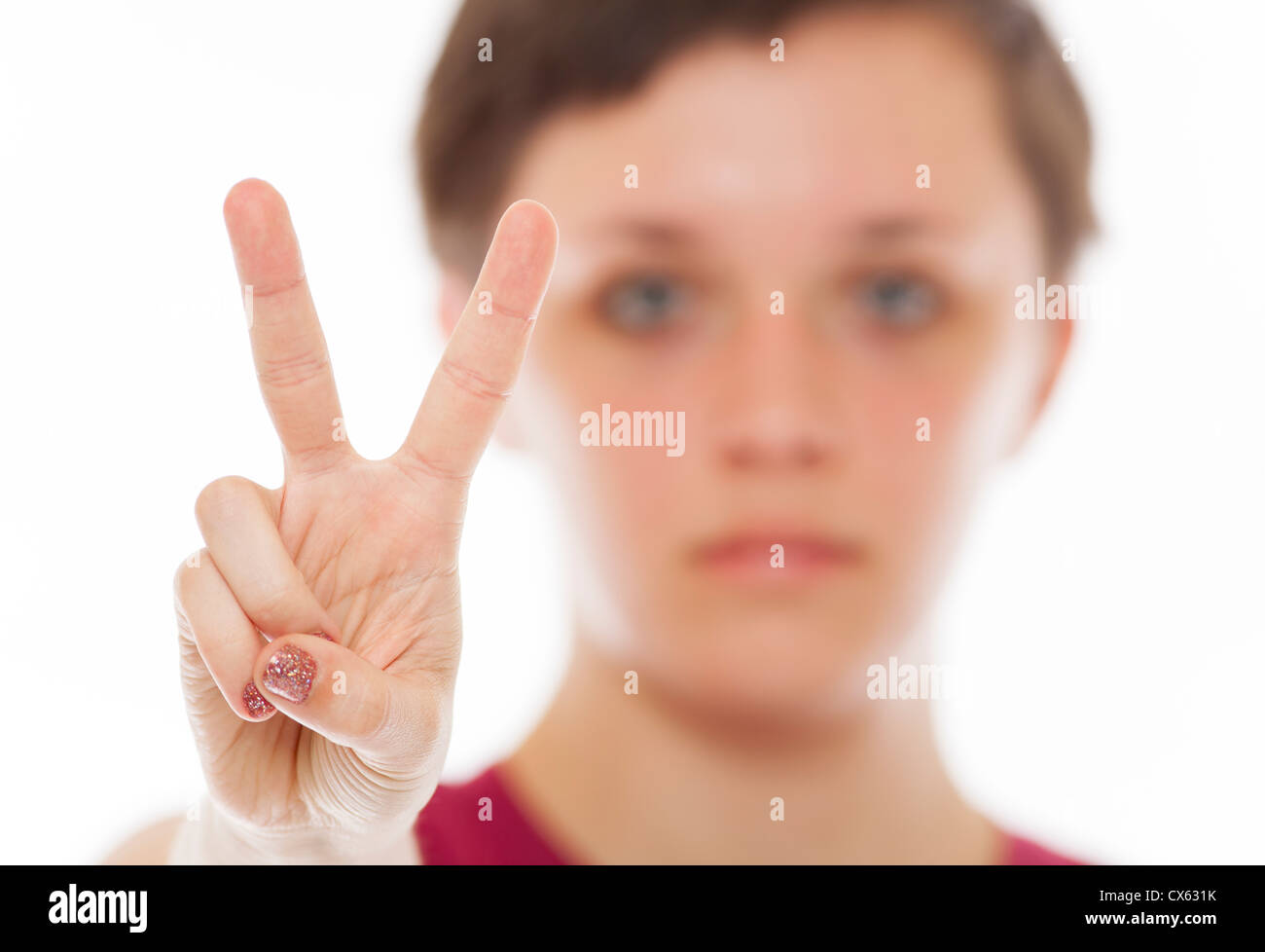 A female teenager making the peace sign Stock Photo - Alamy