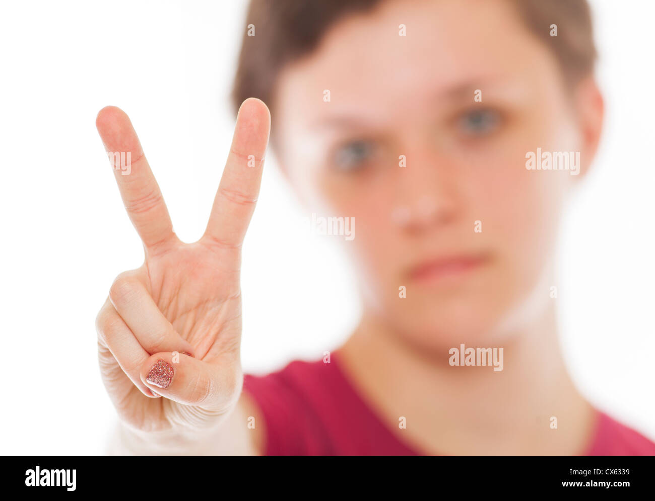 A female teenager making the peace sign Stock Photo - Alamy
