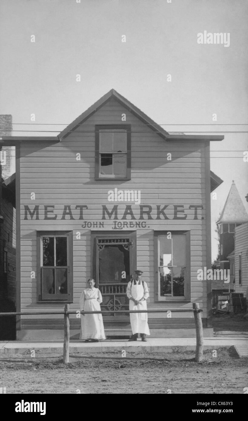 Two People Standing in Front of Meat Market, USA, Circa 1900 Stock ...