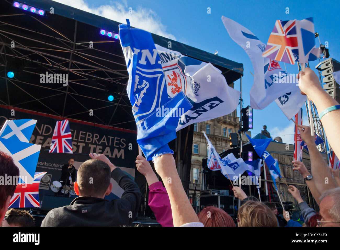 Crowd waving union flags saltires hi-res stock photography and images ...