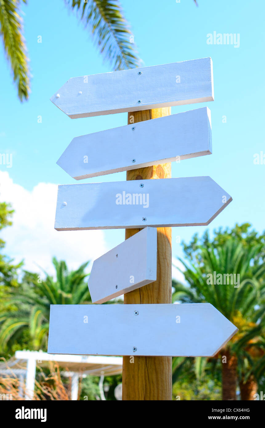 Empty arrow wooden signs at beach Stock Photo - Alamy