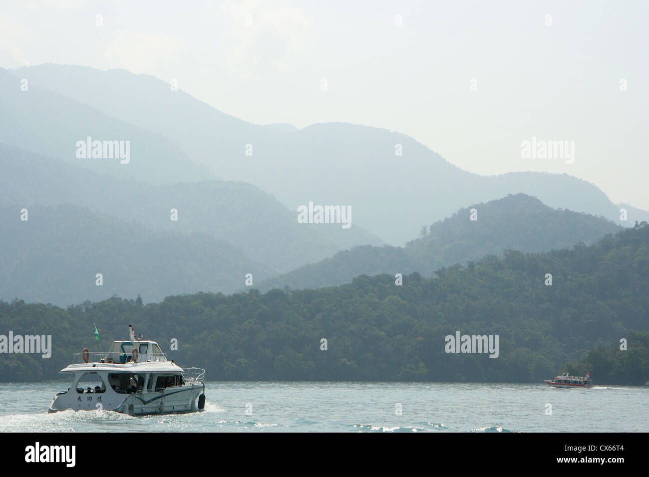 A tourist boat crossing the Sun Moon lake, one of the tourist ...