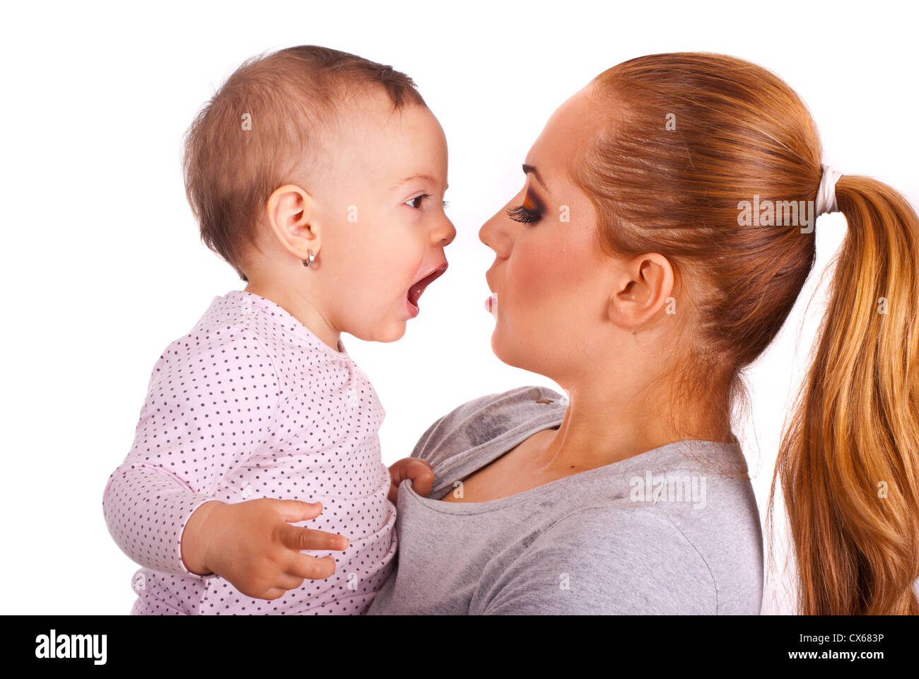 Baby girl talking with mother isolated on white background Stock Photo ...