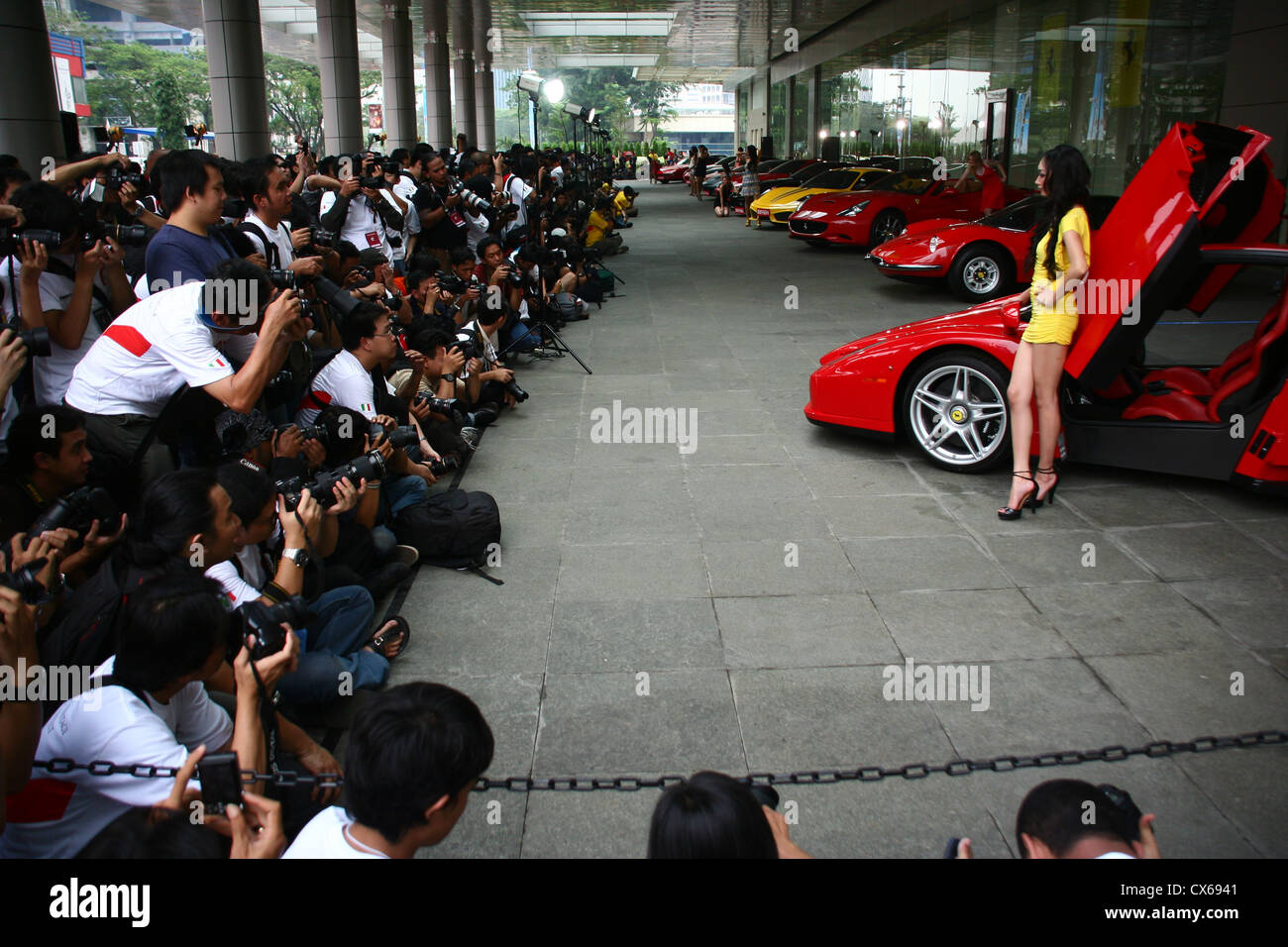 Female model posing with car hi-res stock photography and images - Alamy