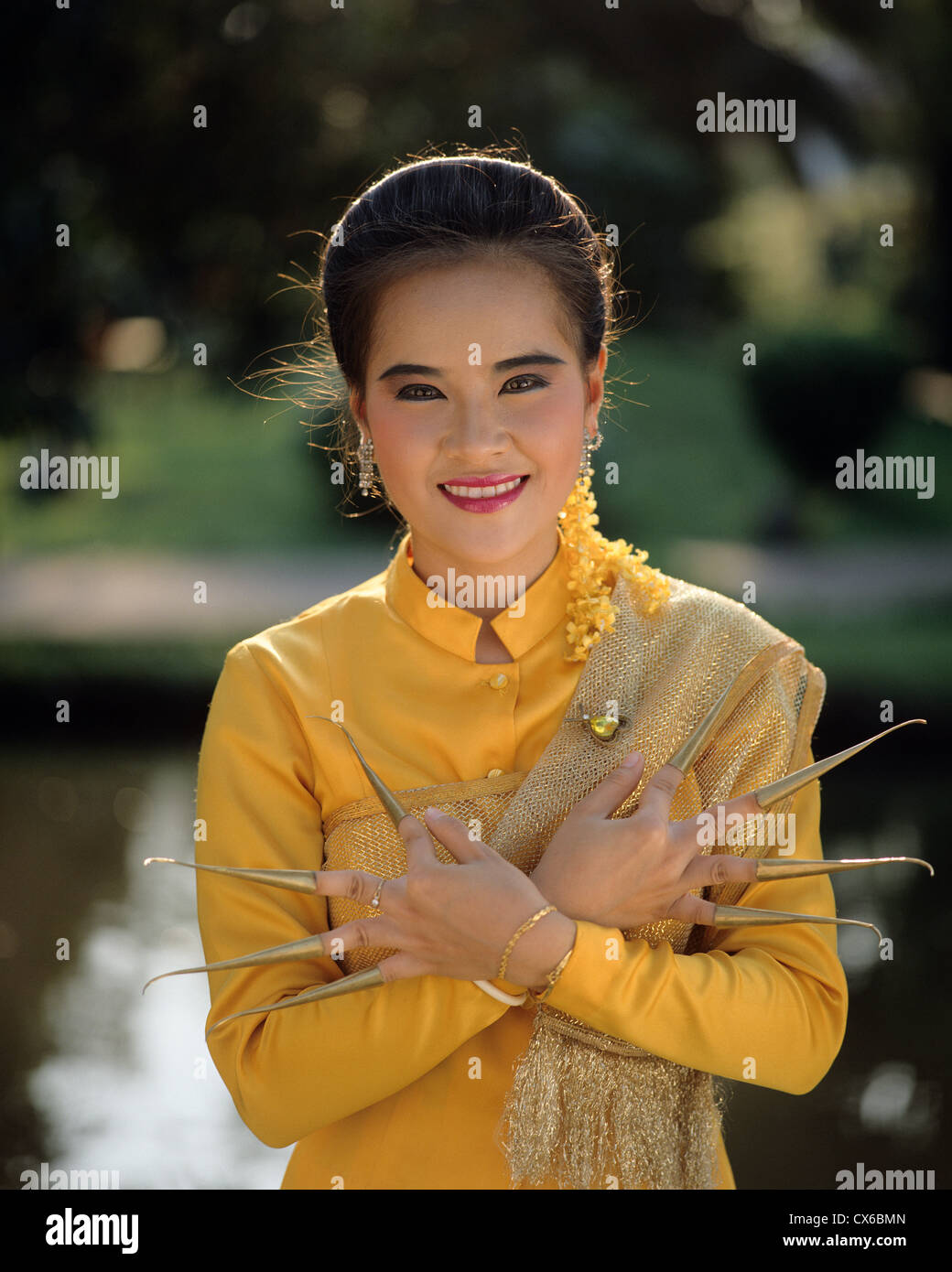 Asia. Thailand. Outdoor portrait of woman in traditional costume ...