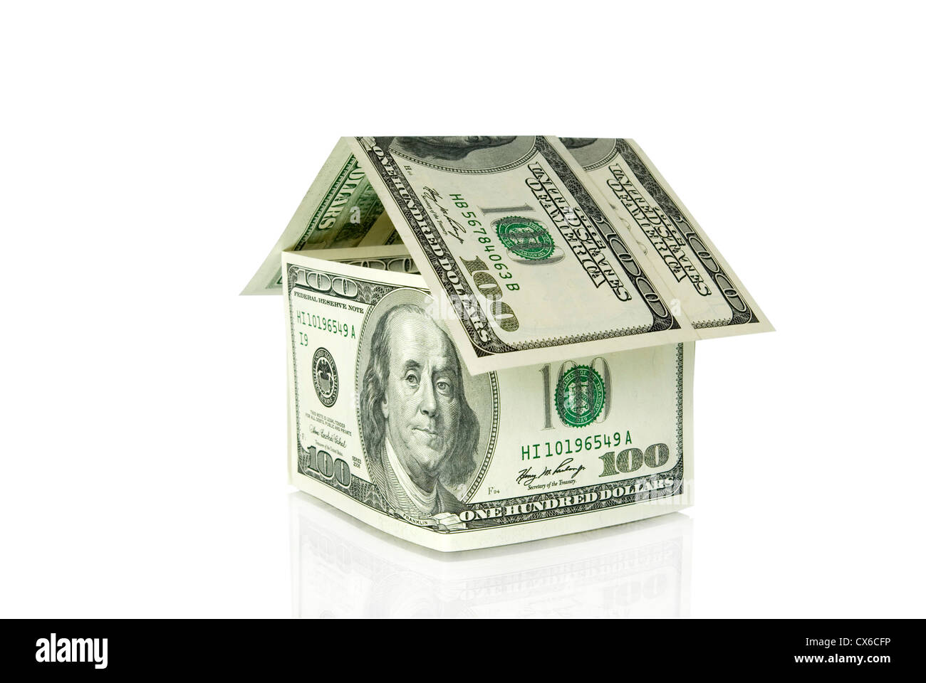 Money house on white background Stock Photo - Alamy