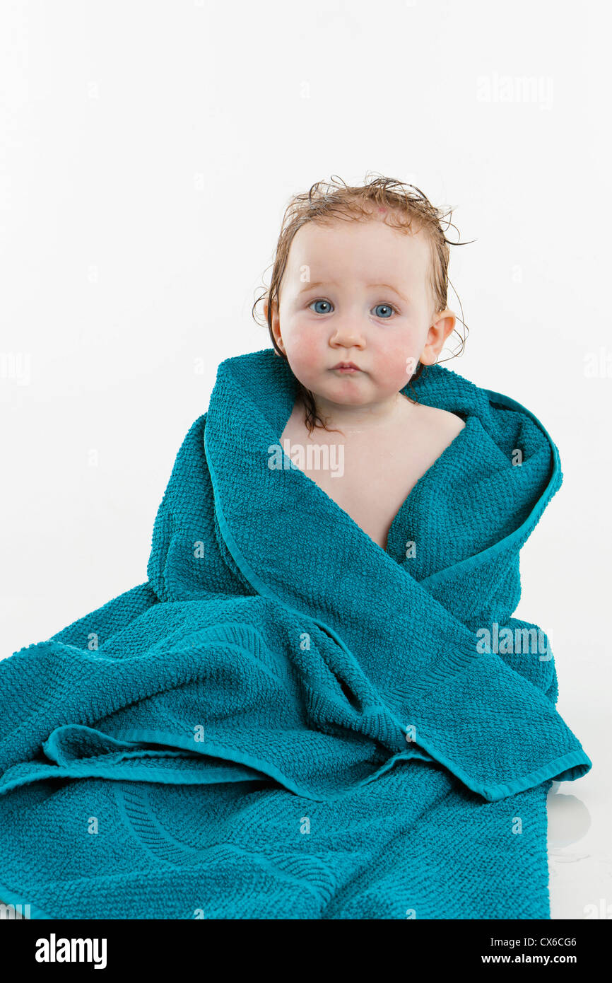 A baby girl wrapped in a towel Stock Photo - Alamy