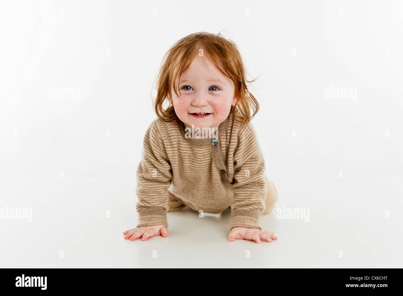 A baby girl crawling Stock Photo - Alamy