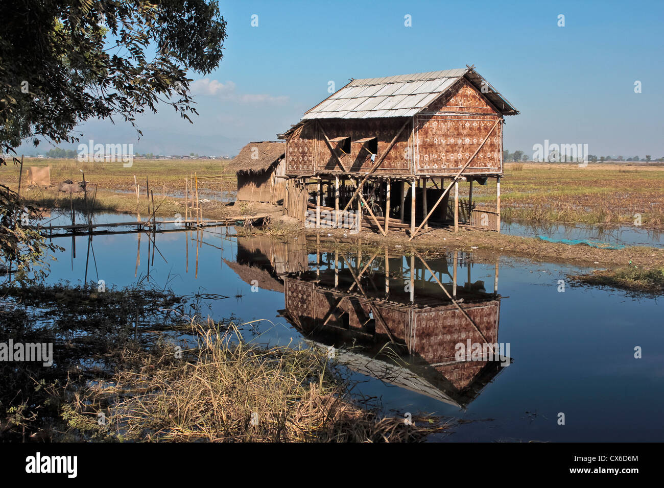 Traditional thatched roof stilt house hi-res stock photography and ...