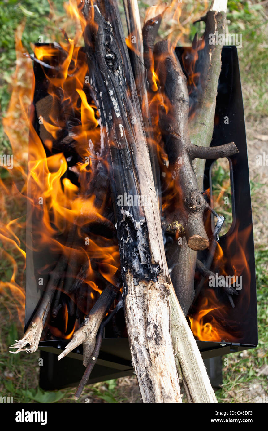Wood burning in a barbeque Stock Photo - Alamy