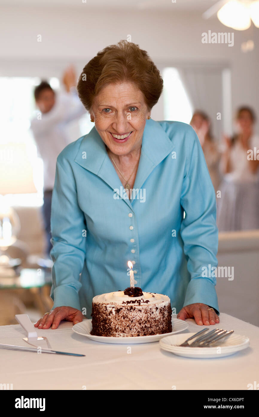 A senior woman with a cake Stock Photo - Alamy