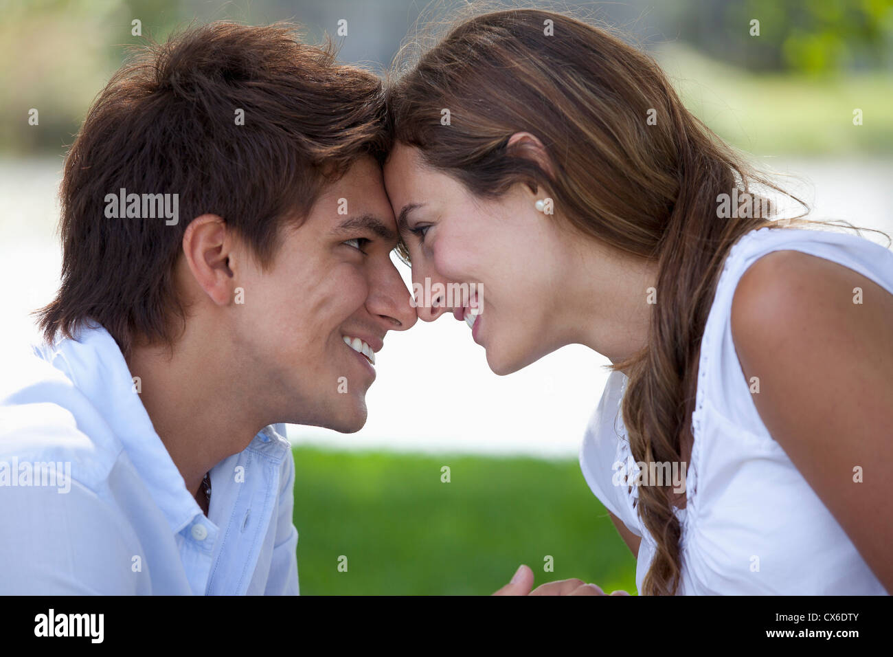 A young couple face to face Stock Photo - Alamy