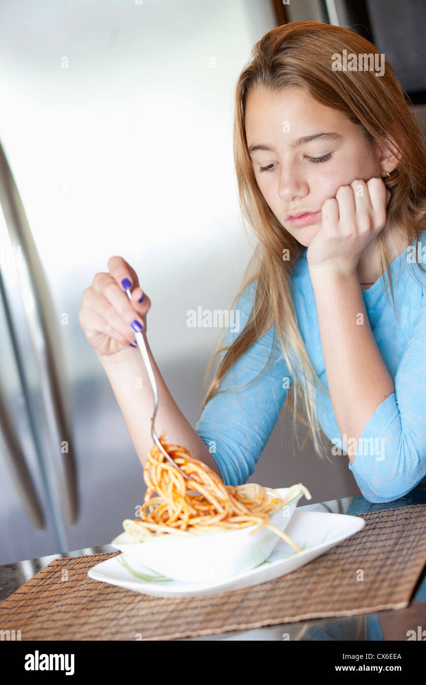 Girl unhappy with her spaghetti meal Stock Photo - Alamy