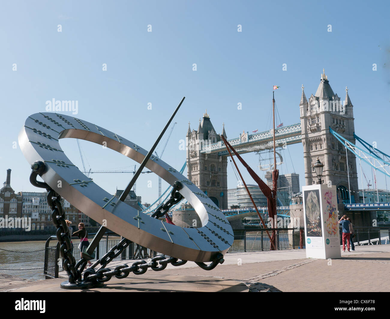 Tower Bridge from St Katherine Docks area with the giant sundial in the ...