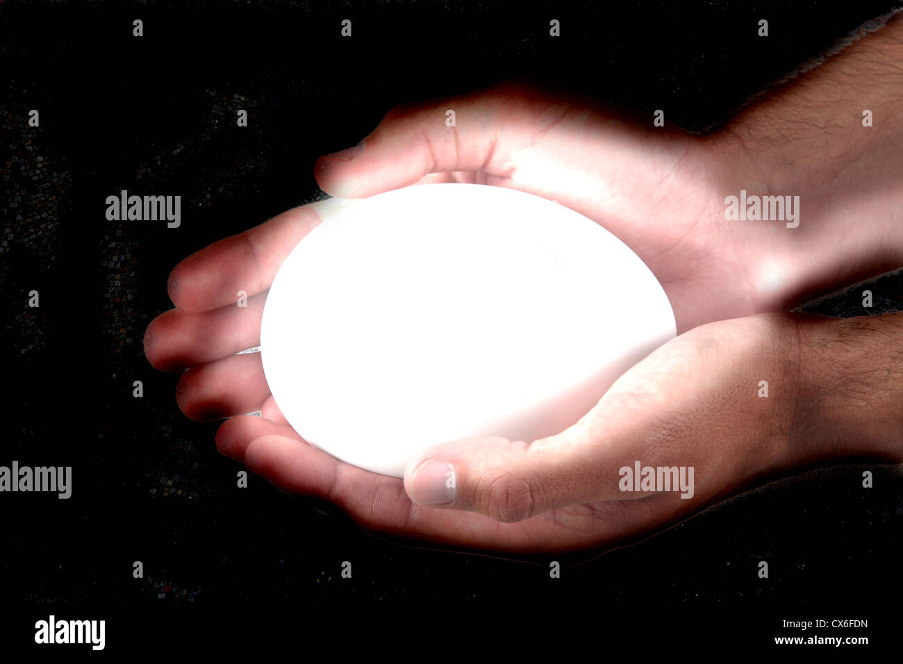 Man's hands holding light Stock Photo - Alamy