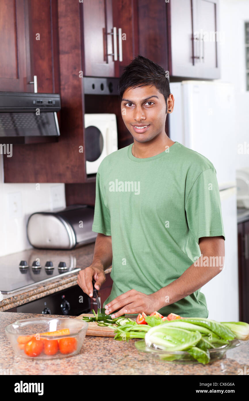 happy young man cooking in kitchen Stock Photo - Alamy