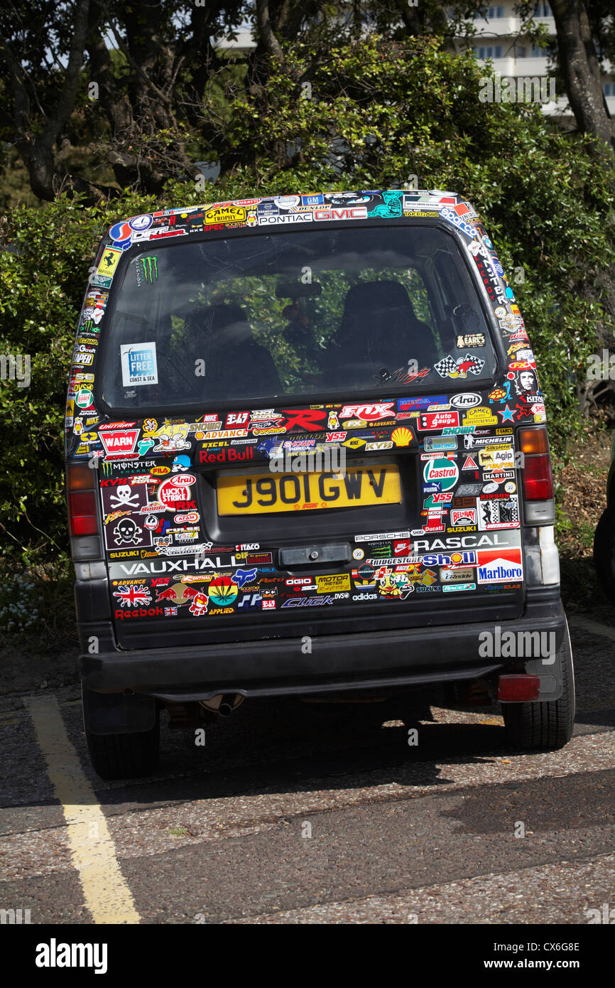Rear view of Vauxhall Rascal camper van campervan covered in lots of ...