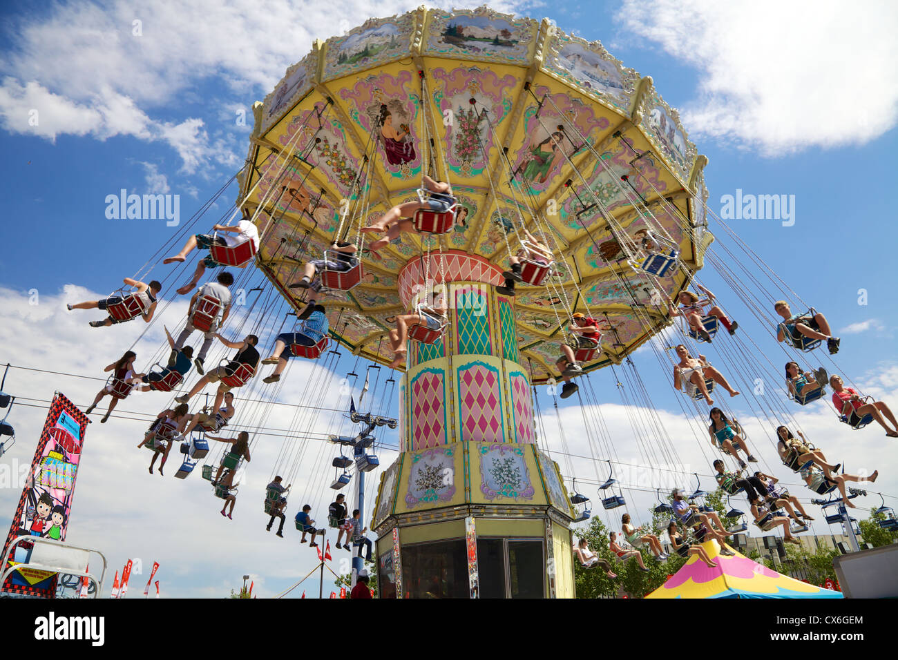 Kids enjoy a carousel ride at Calgary stampede, Alberta, Canada Stock ...