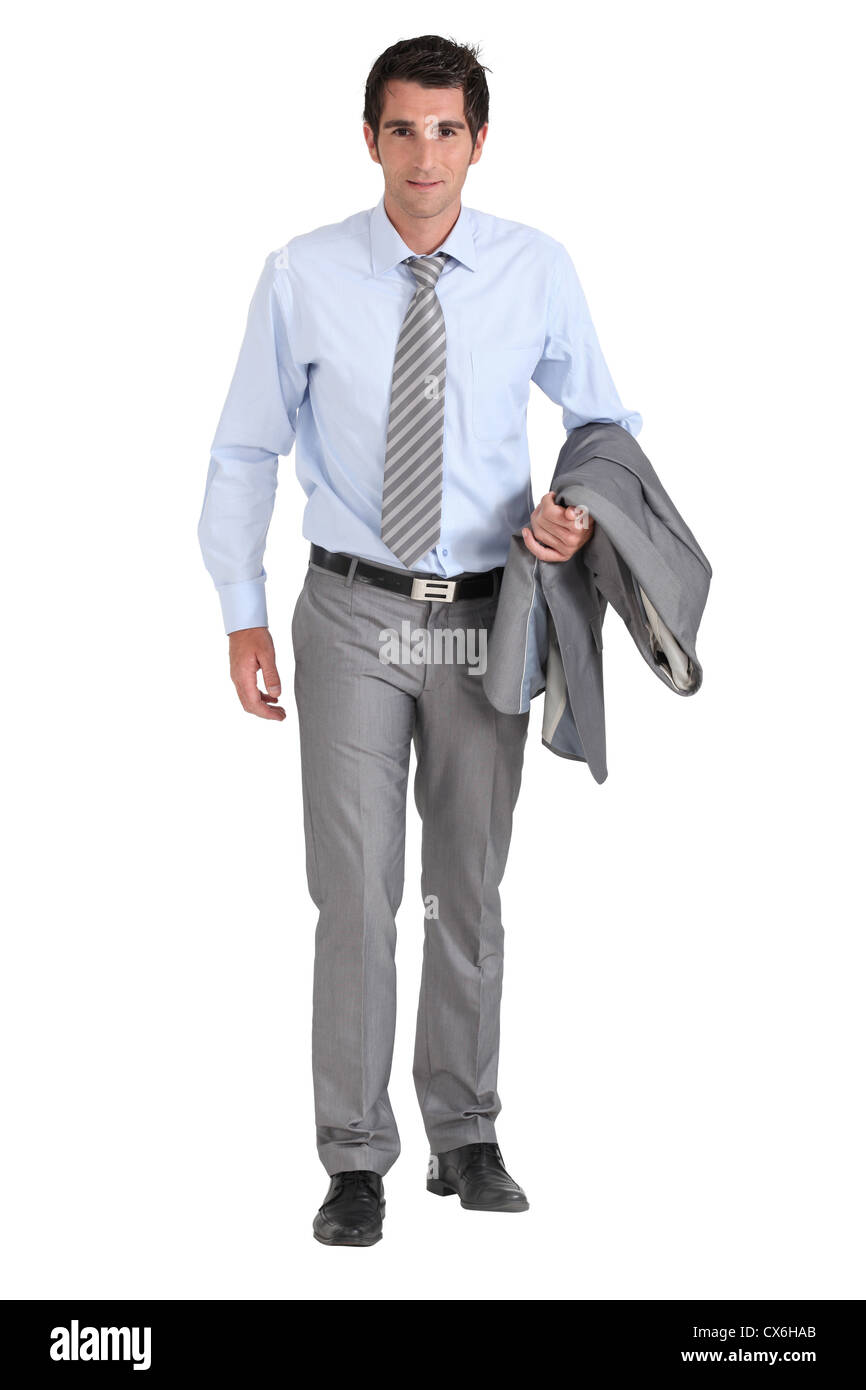 Relaxed businessman walking Cut Out Stock Images & Pictures - Alamy
