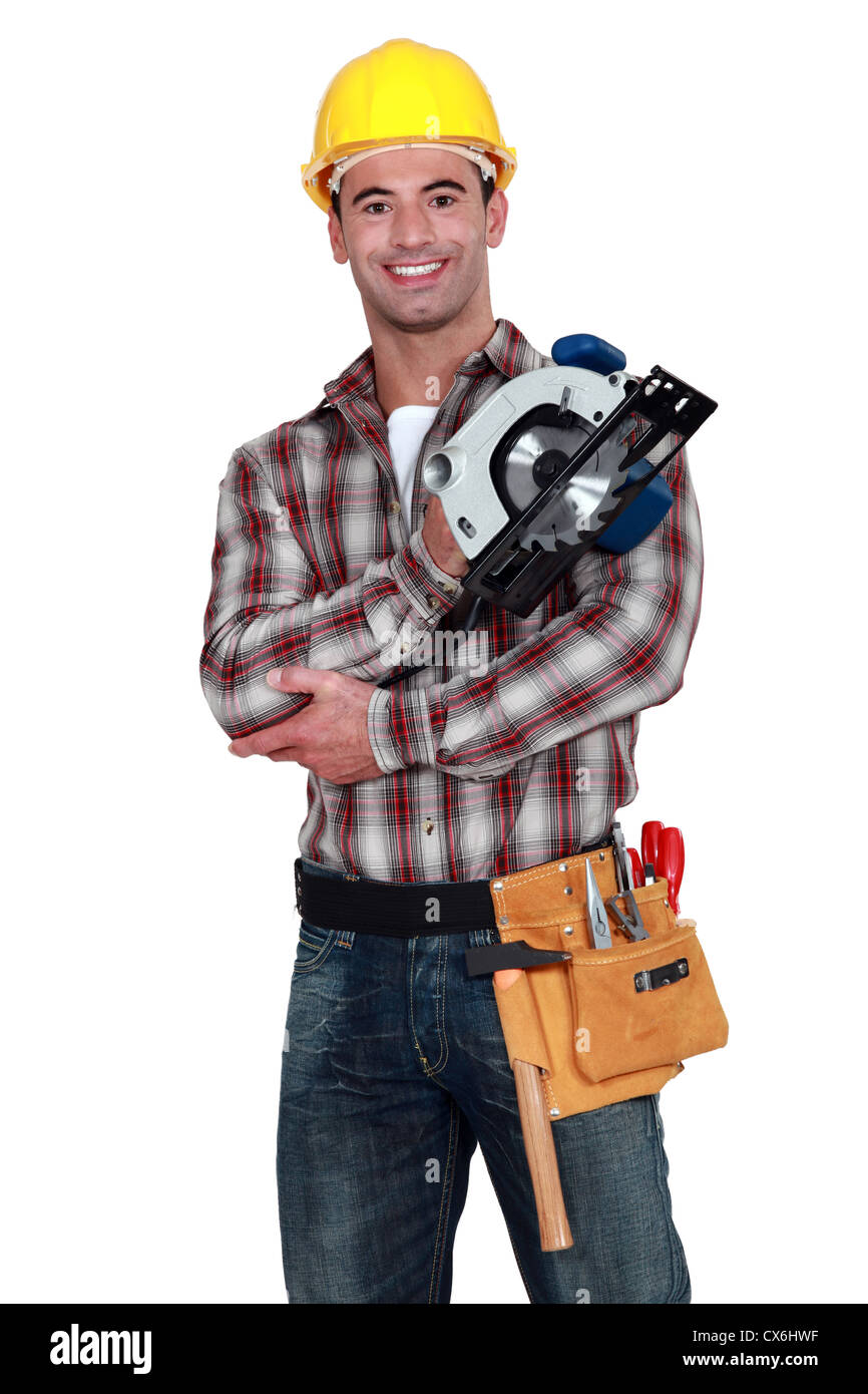 Man holding a circular saw Stock Photo - Alamy