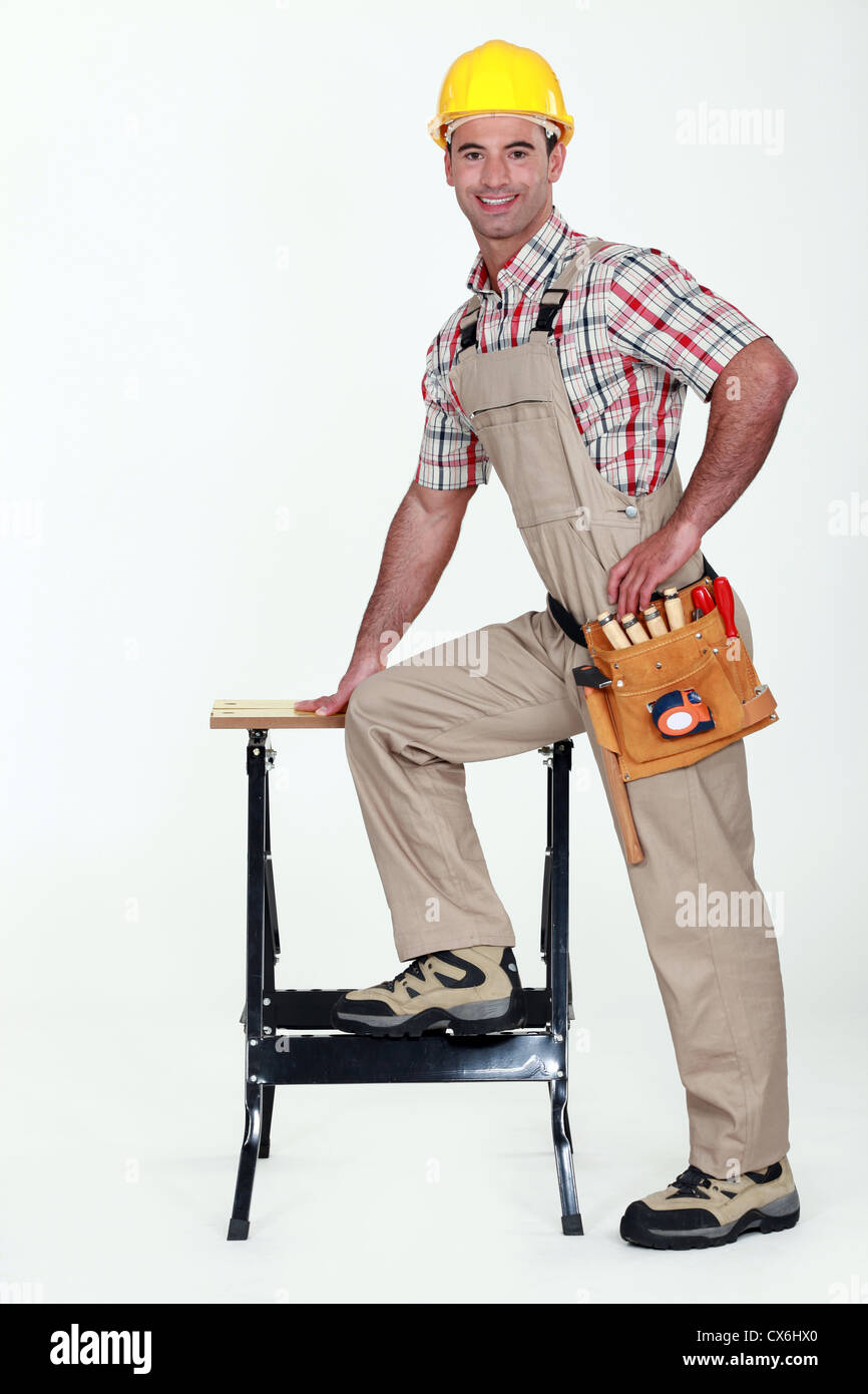 Carpenter stood by work-bench Stock Photo - Alamy
