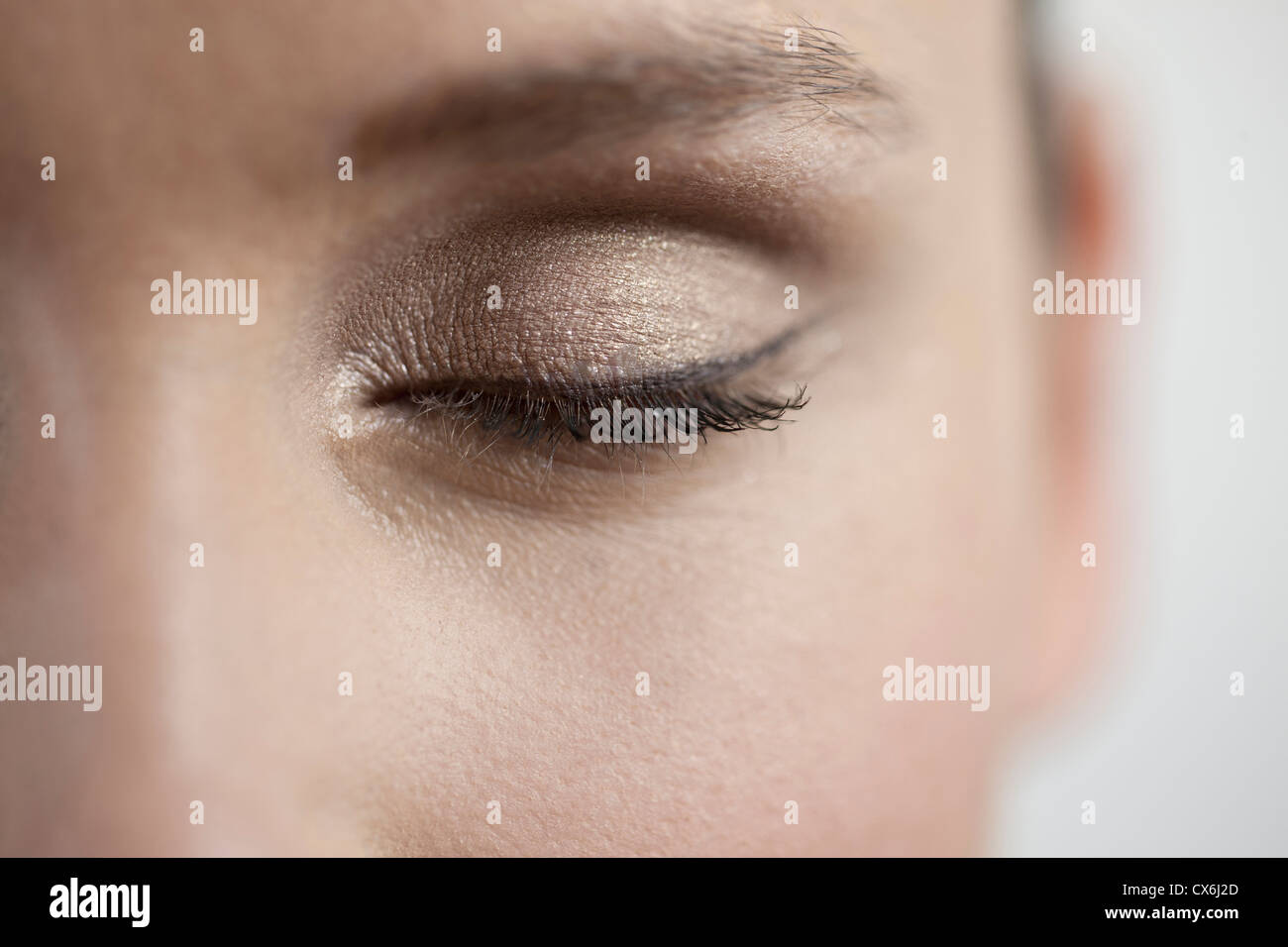 Close up of a young womans eye, closed Stock Photo - Alamy