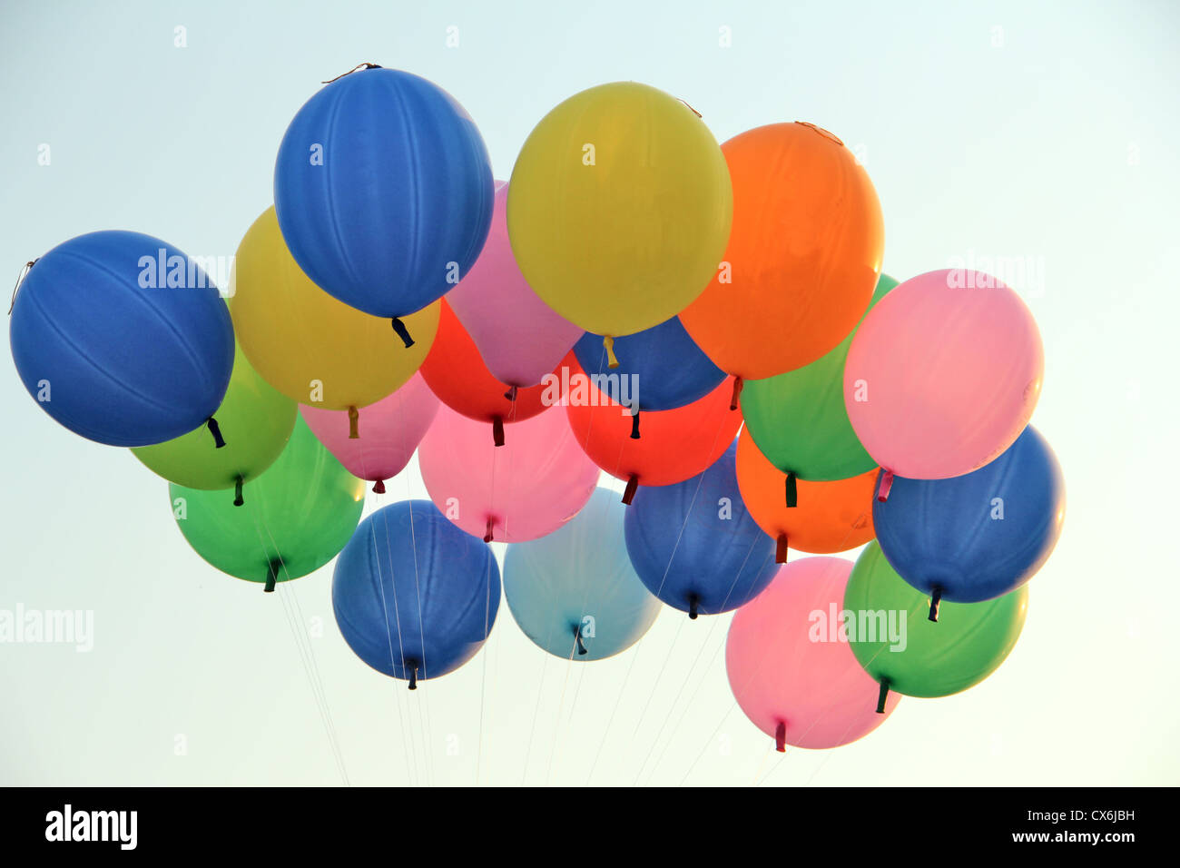 Colour balloons on blue sky Stock Photo - Alamy