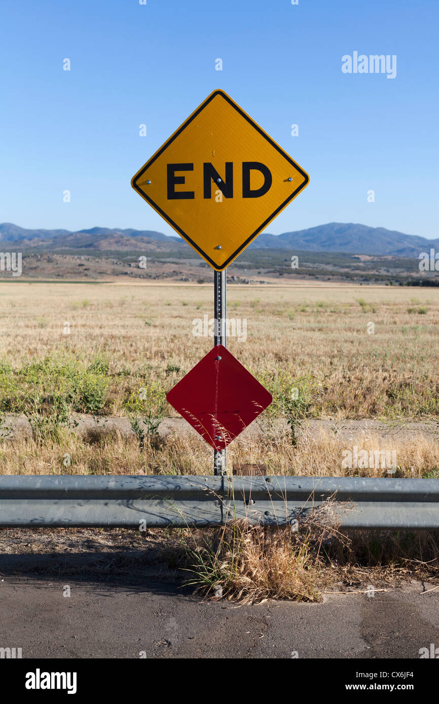 An END road sign and mountain ranges behind Stock Photo - Alamy