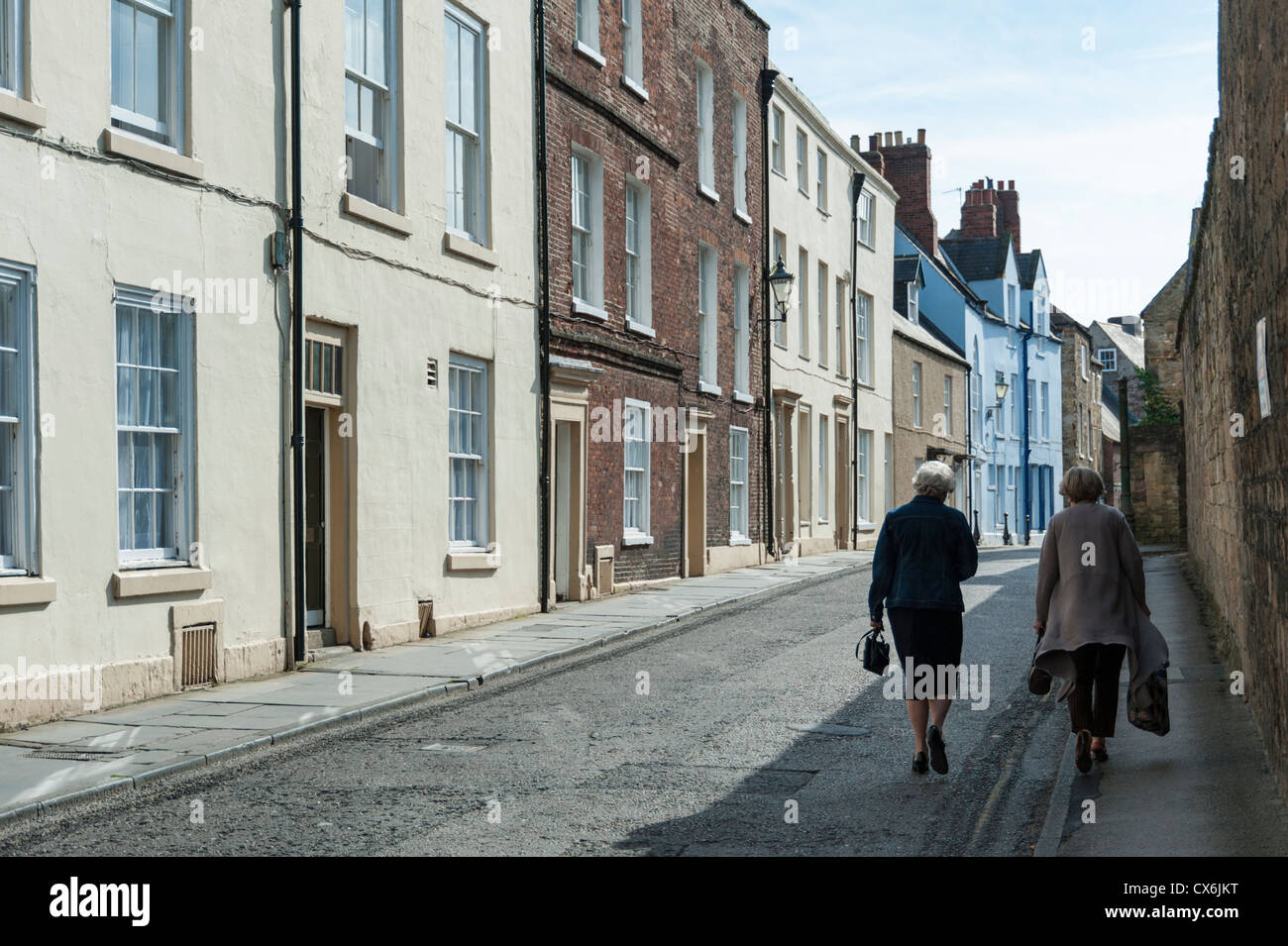 North Bailey Street in the city of Durham UK with two women walking in ...
