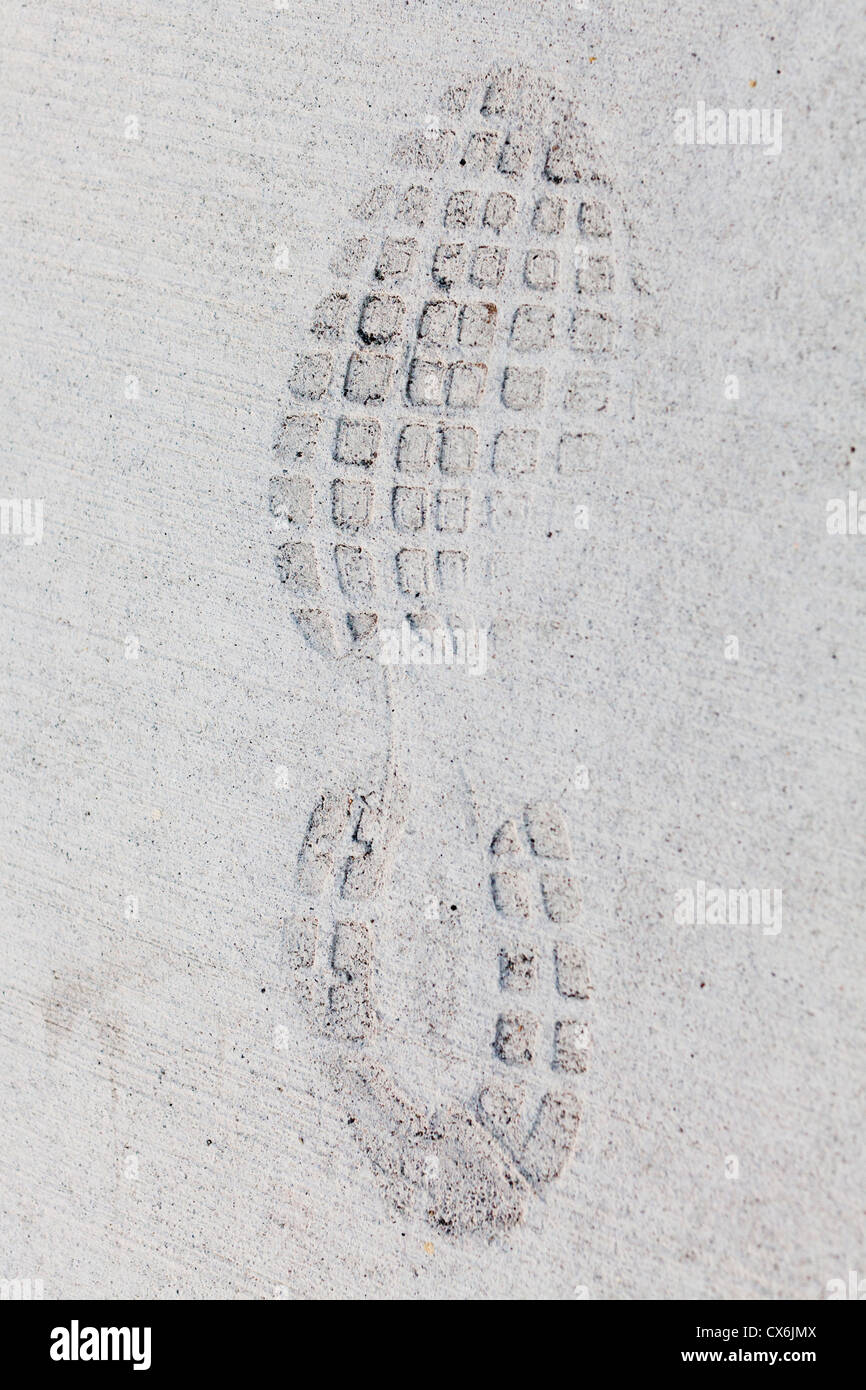 Imprint of a sports shoe in concrete Stock Photo - Alamy