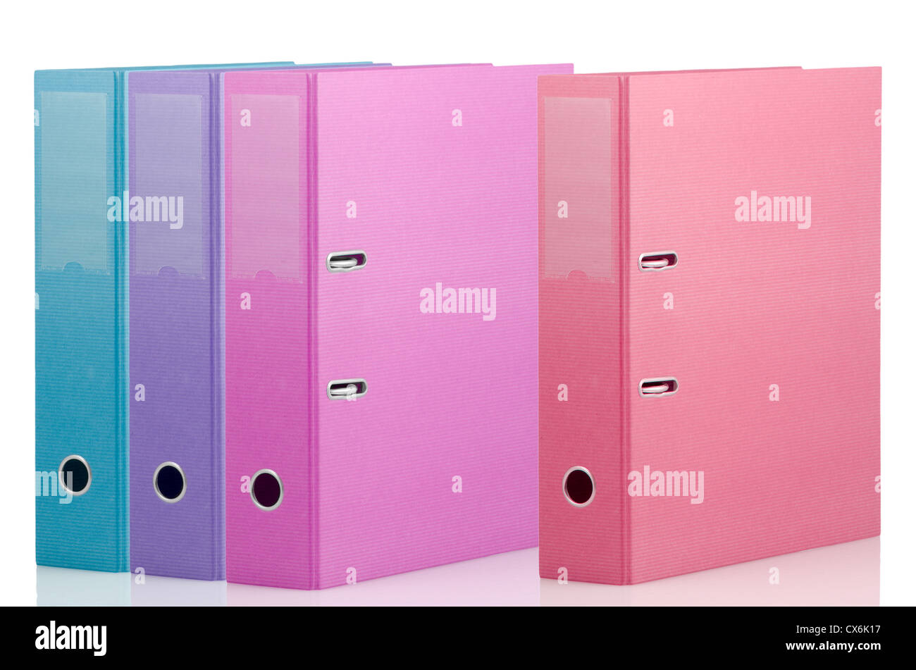 Four different color binders on white background Stock Photo - Alamy