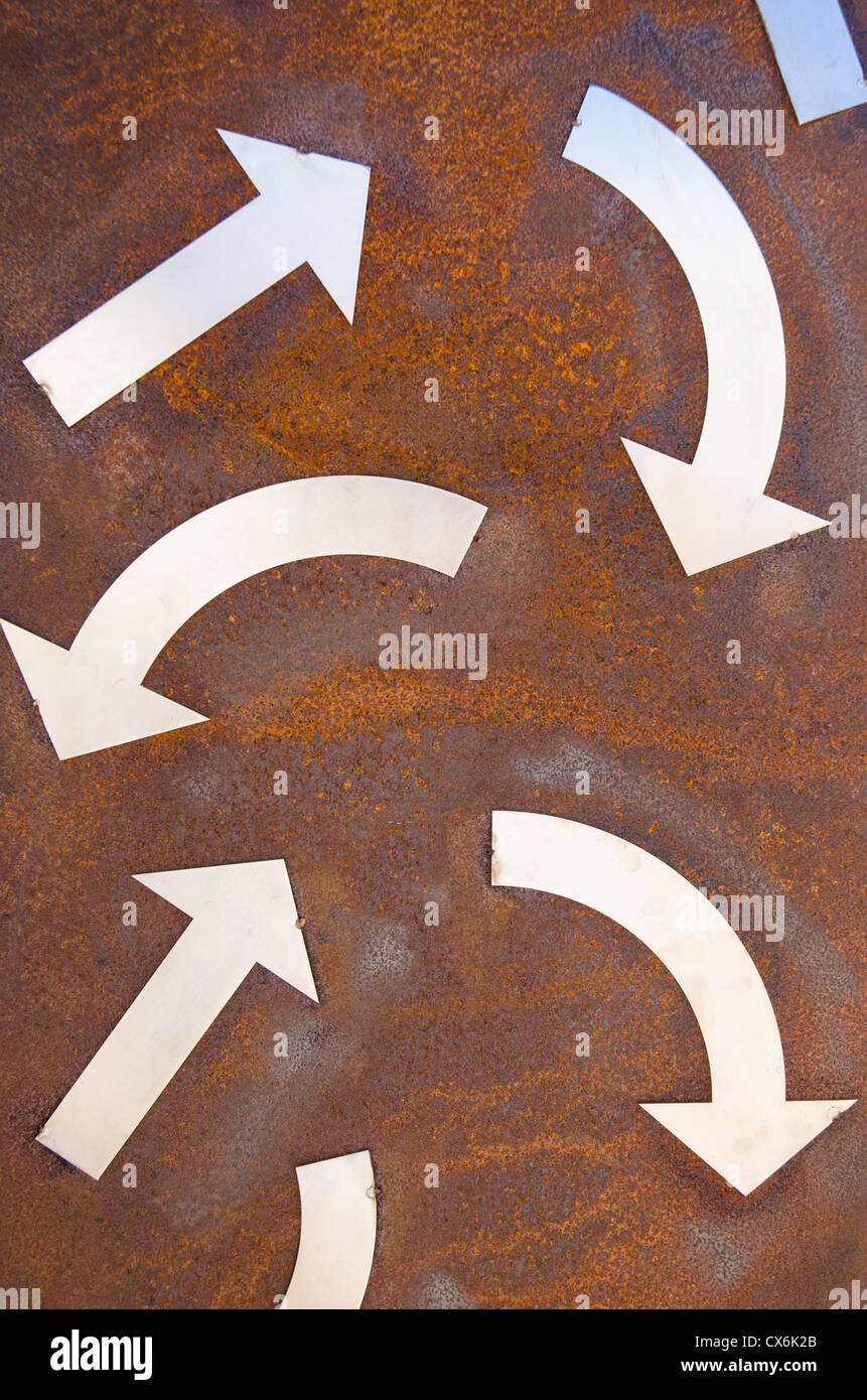 Rusty turn arrow signs background Stock Photo - Alamy
