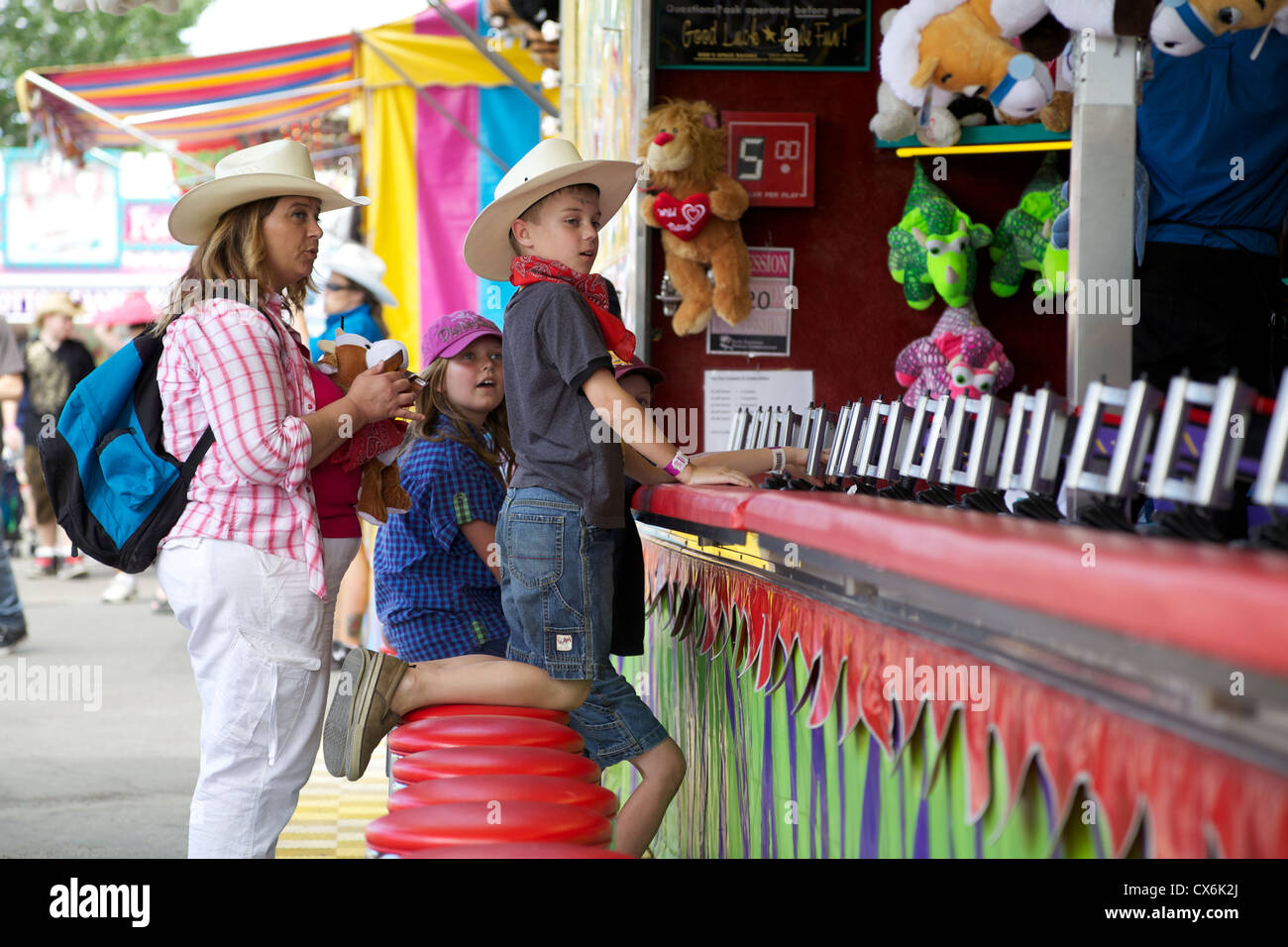 Kids look into a game shop at the Calgary Stampede event, Alberta ...