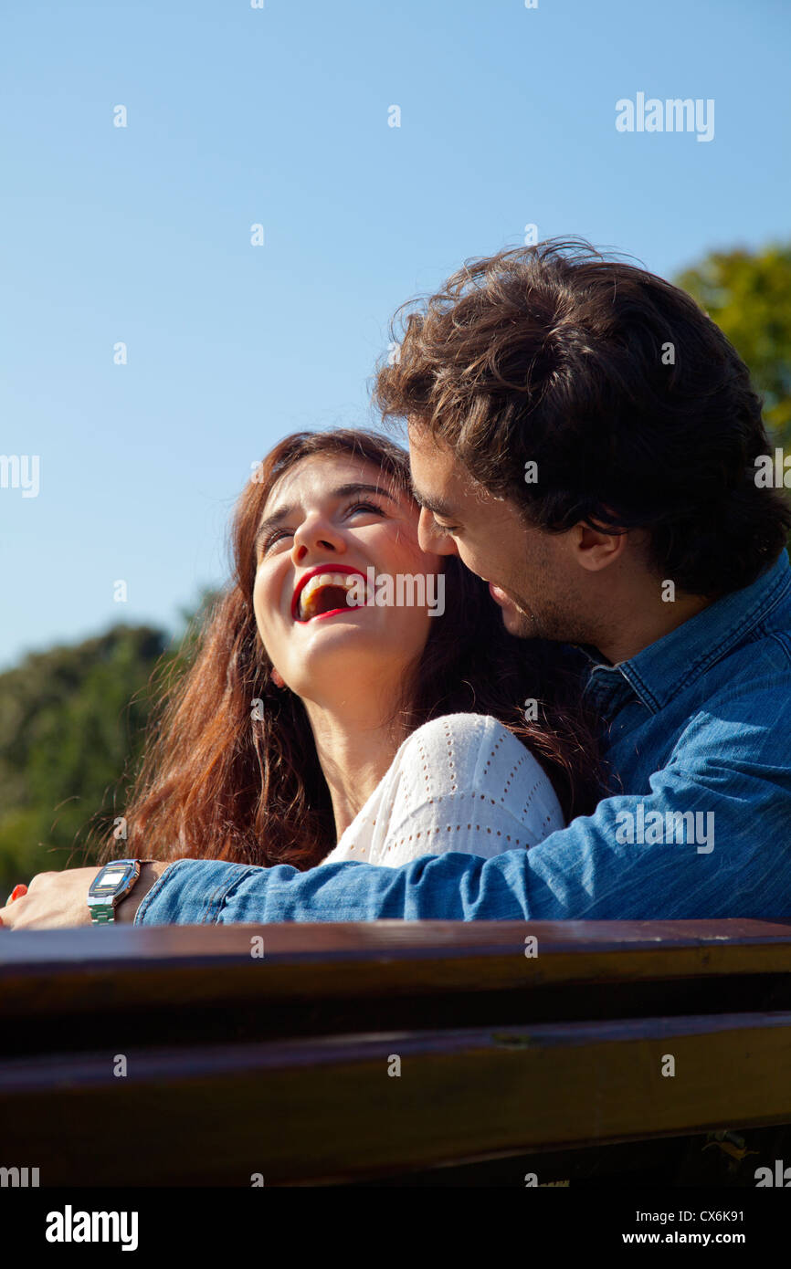 Intimate Couple on Bench Stock Photo - Alamy
