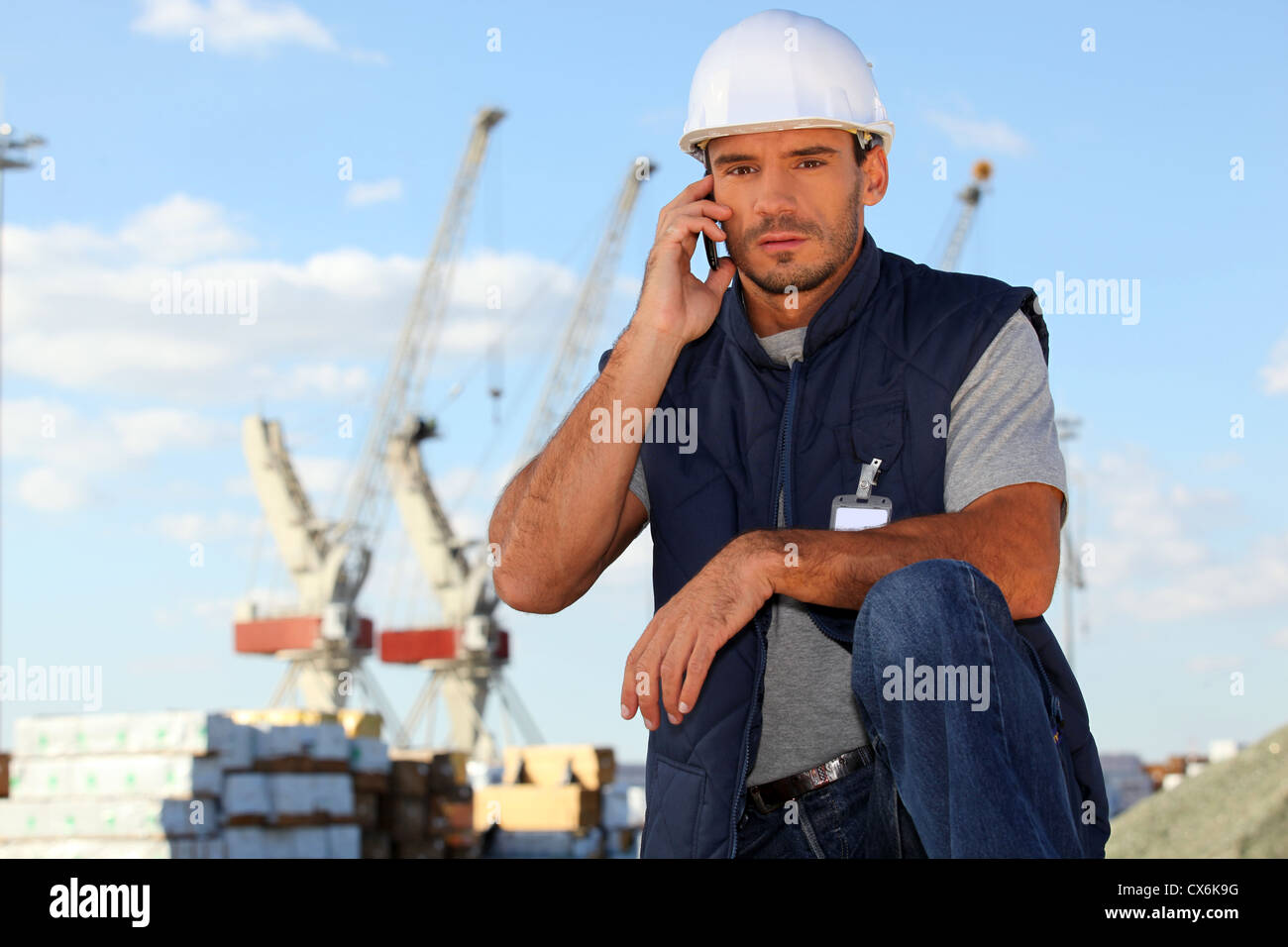 Foreman using radio to communicate on site Stock Photo - Alamy