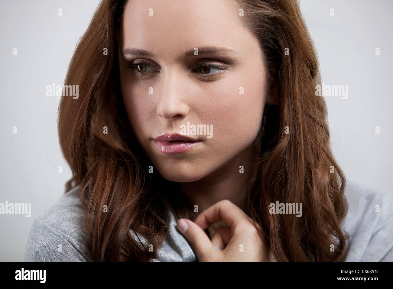 A young woman looking thoughtful Stock Photo - Alamy A young woman looking thoughtful Stock Photo - Alamy