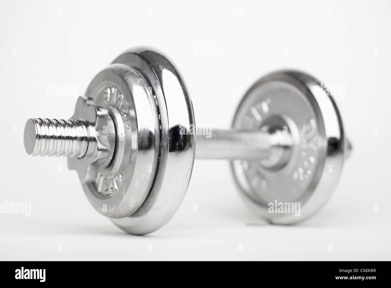 A shiny silver dumbbell Stock Photo - Alamy