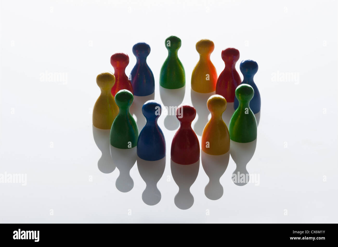 Different colored game pieces arranged in a circle Stock Photo - Alamy
