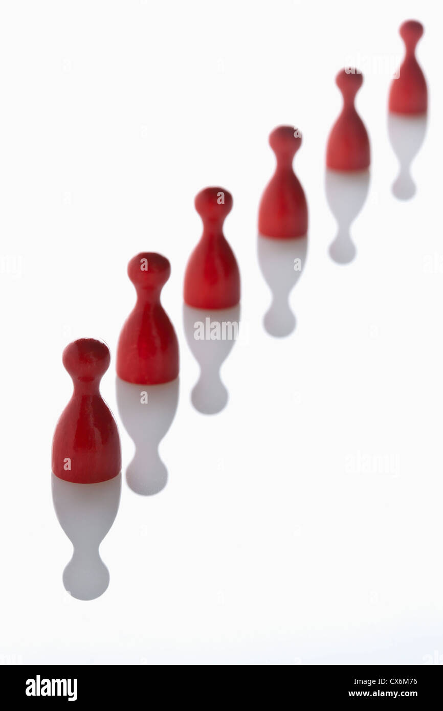 Red game pieces in a row Stock Photo - Alamy